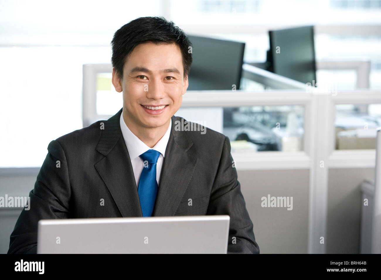 Office worker at his desk Stock Photo - Alamy