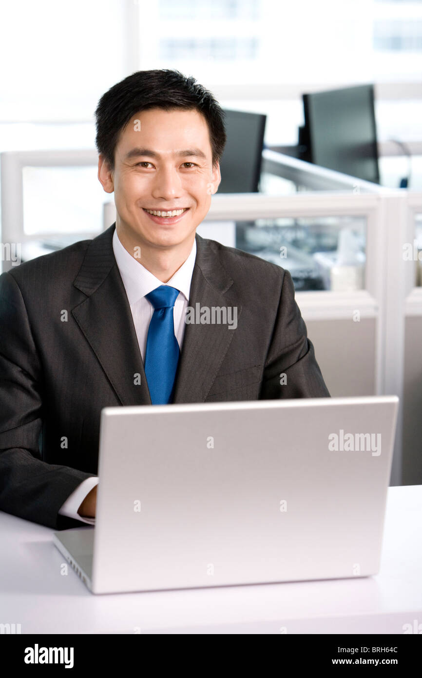 Office worker at his desk Stock Photo - Alamy
