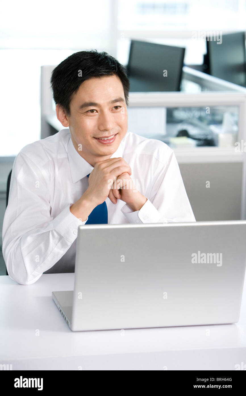Office worker at his desk Stock Photo - Alamy