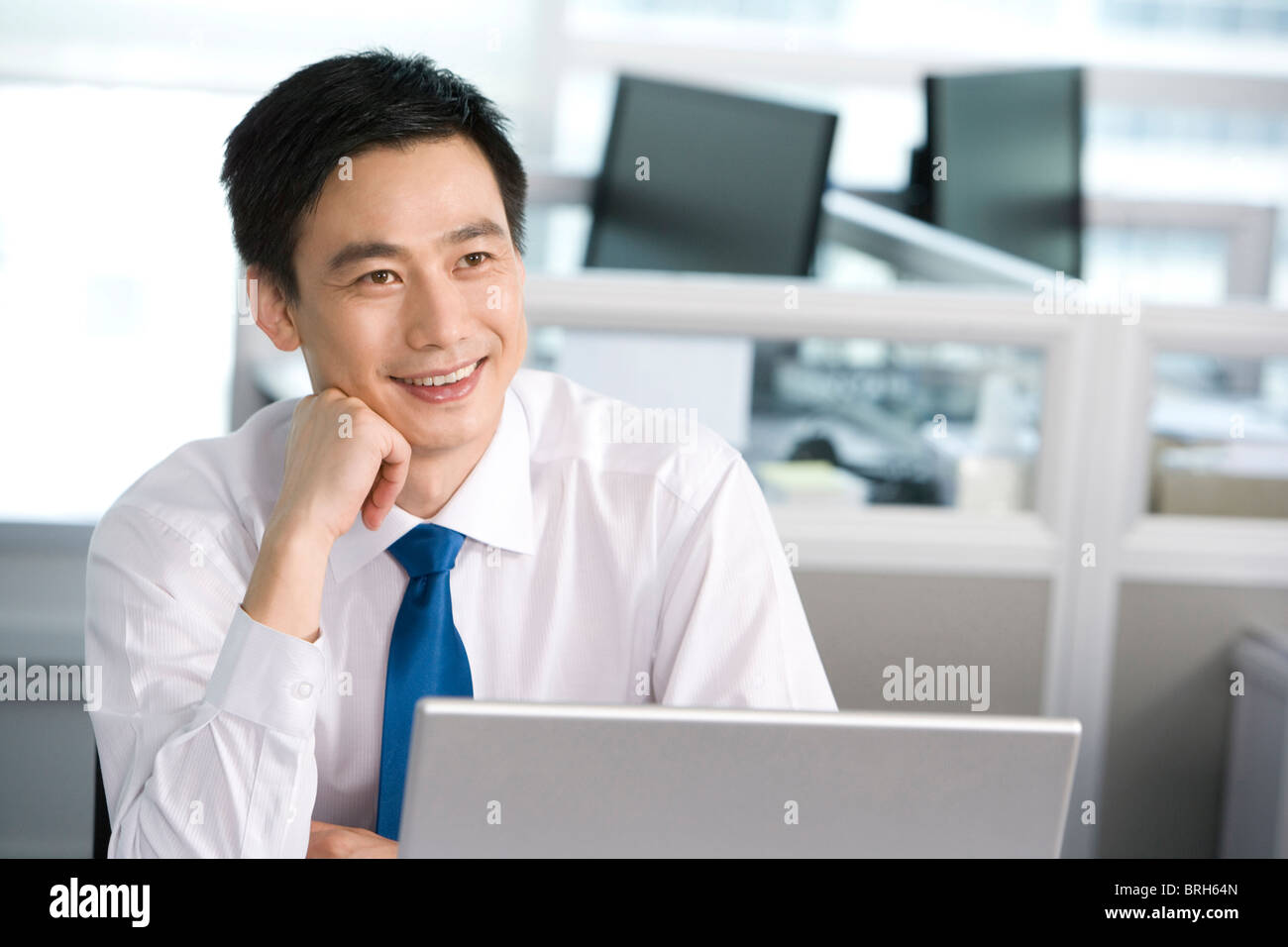 Office worker at his desk Stock Photo - Alamy