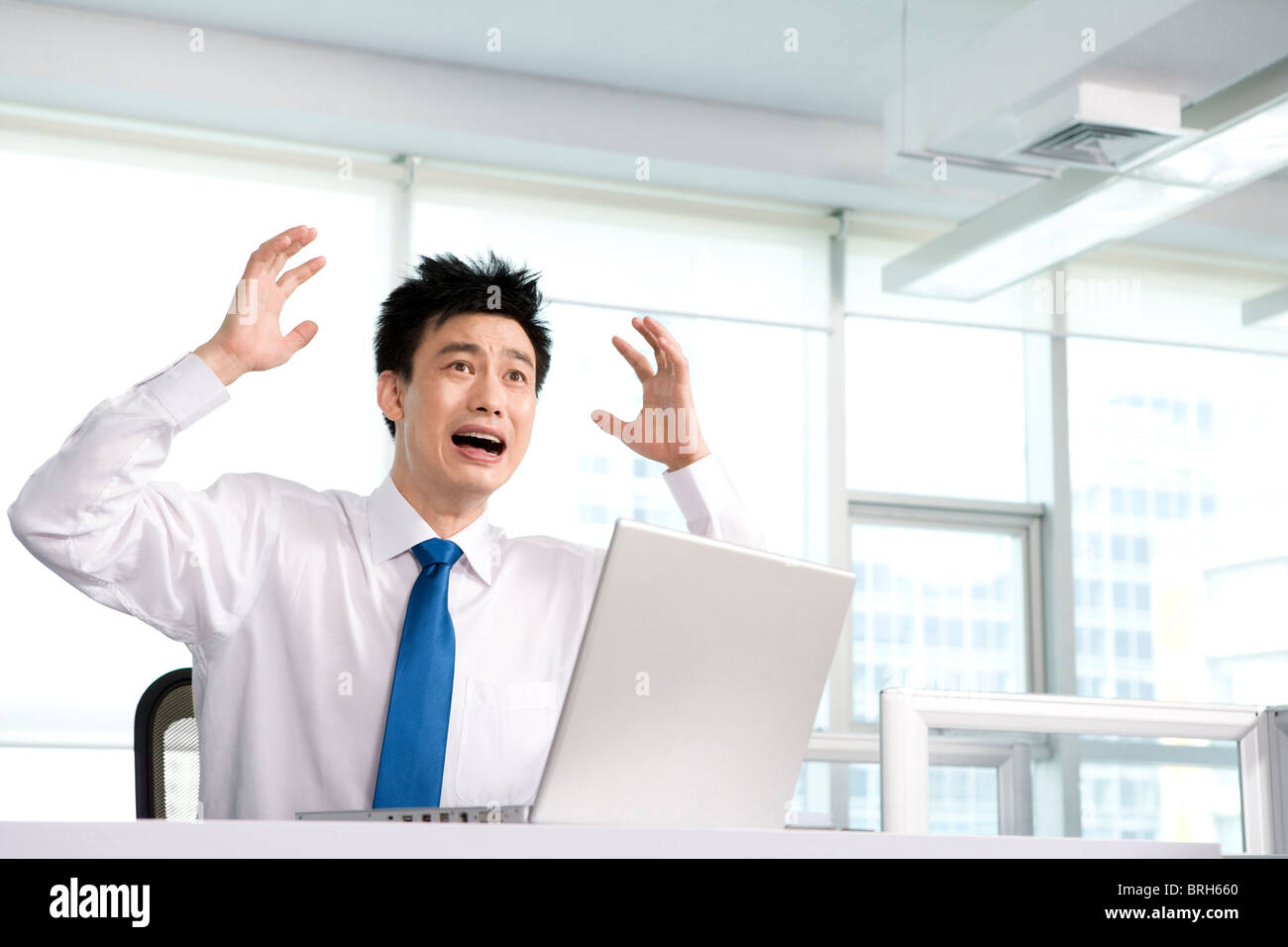 Frustrated office work at his desk Stock Photo - Alamy