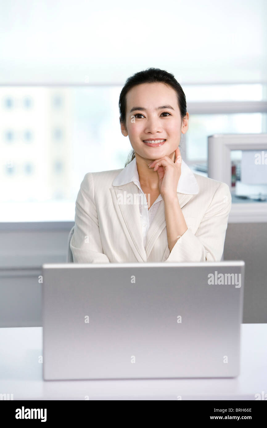 Office worker at her desk Stock Photo - Alamy