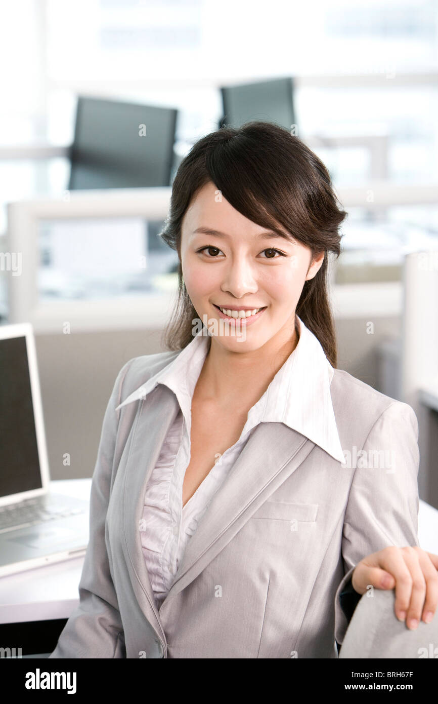 Office worker at her desk Stock Photo - Alamy
