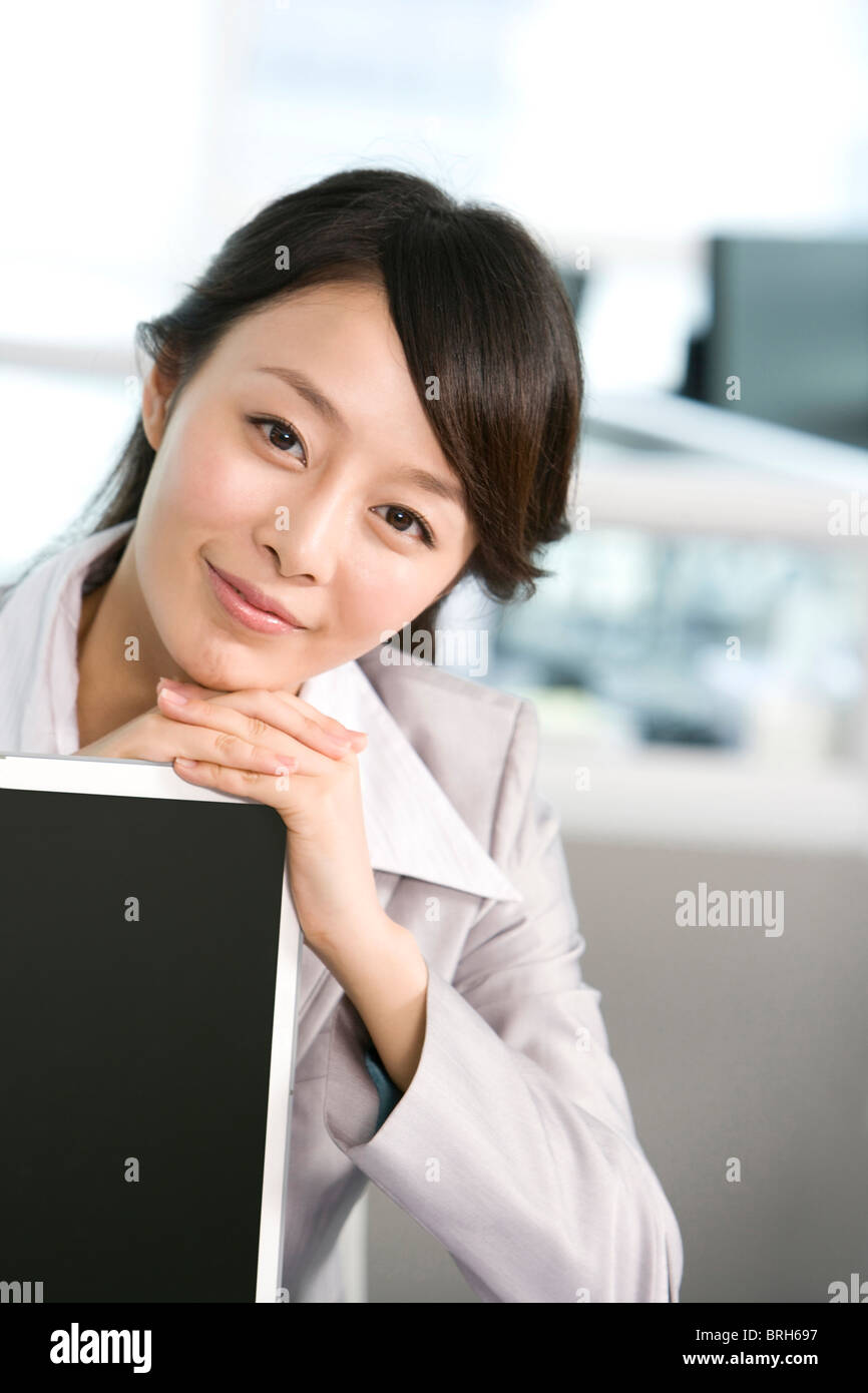 Office worker at her desk Stock Photo - Alamy