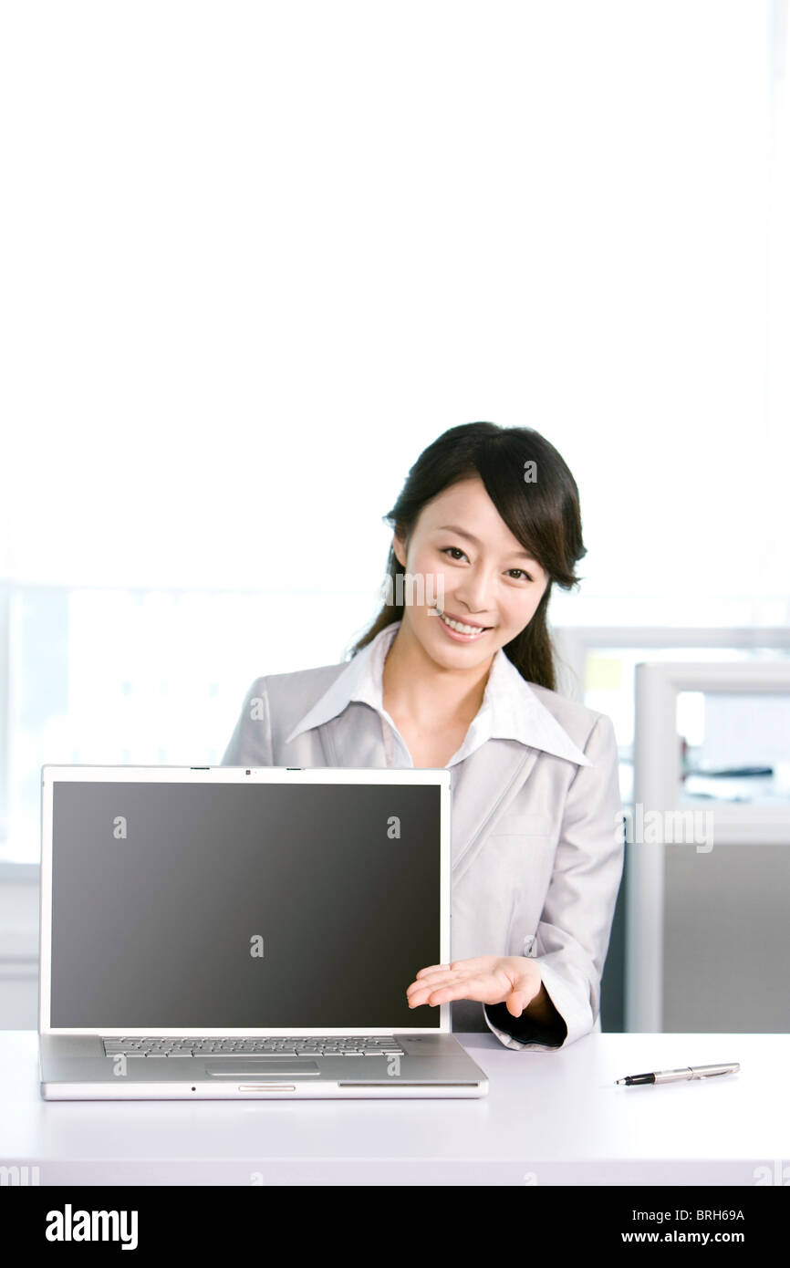 Office worker at her desk Stock Photo - Alamy