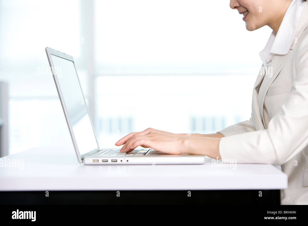 Office worker using her computer Stock Photo - Alamy