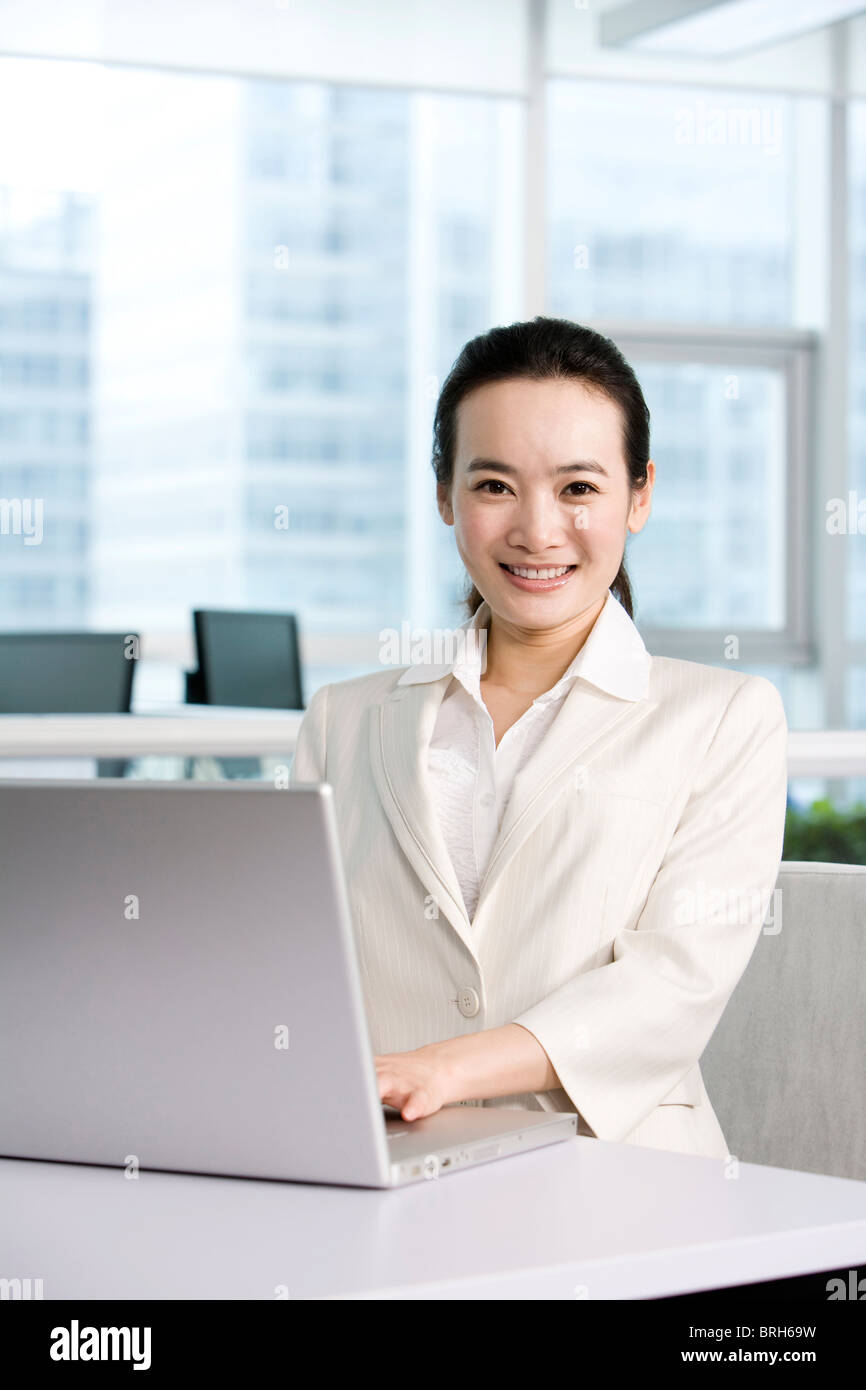 Office worker at her desk Stock Photo - Alamy