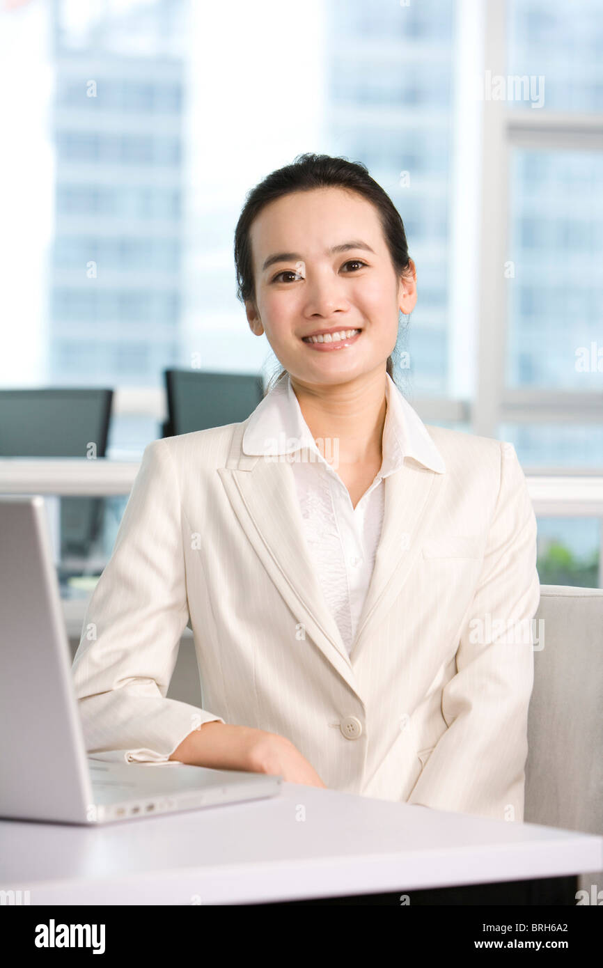 Office worker at her desk Stock Photo - Alamy