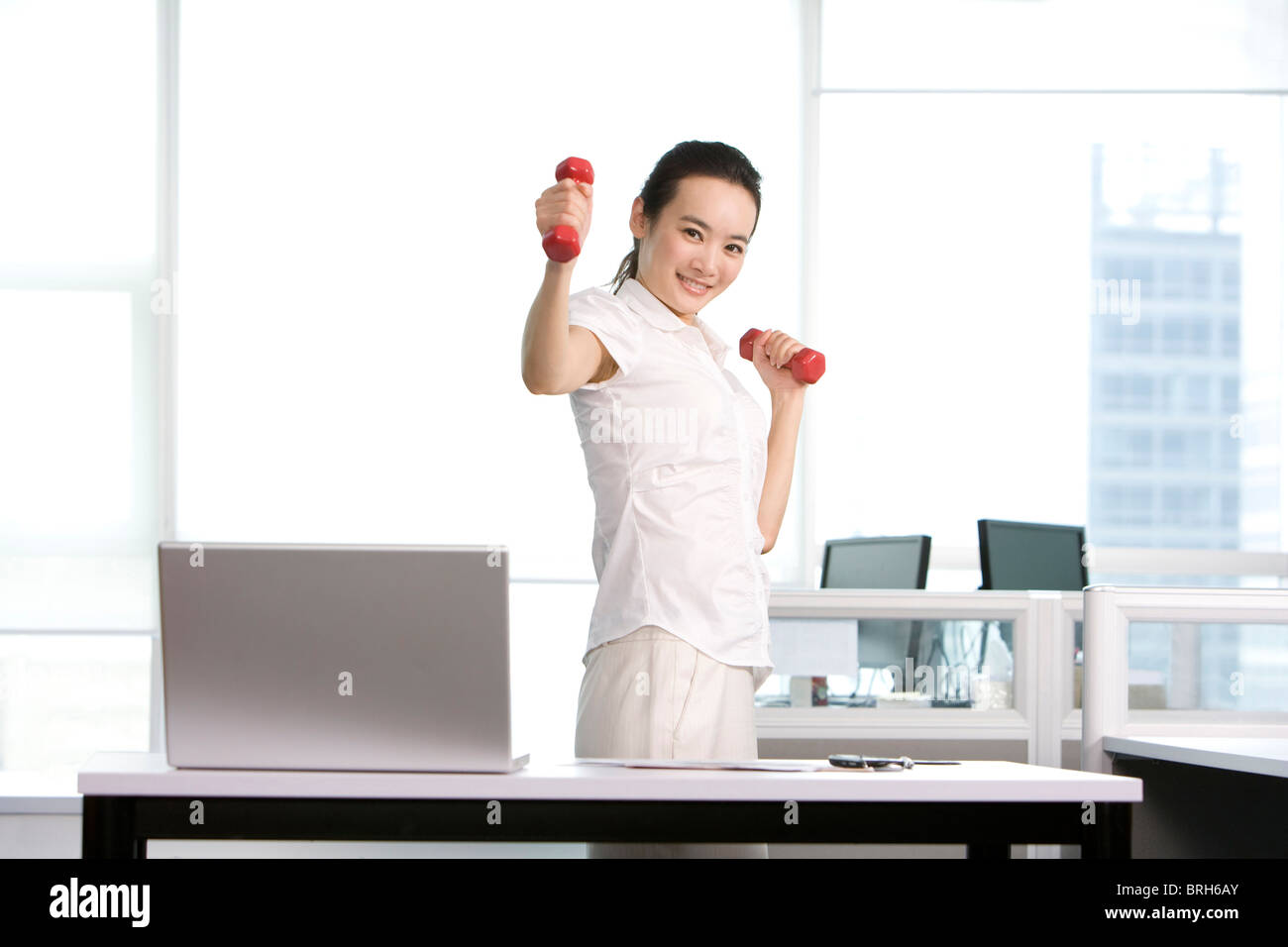 Working out in the office Stock Photo - Alamy