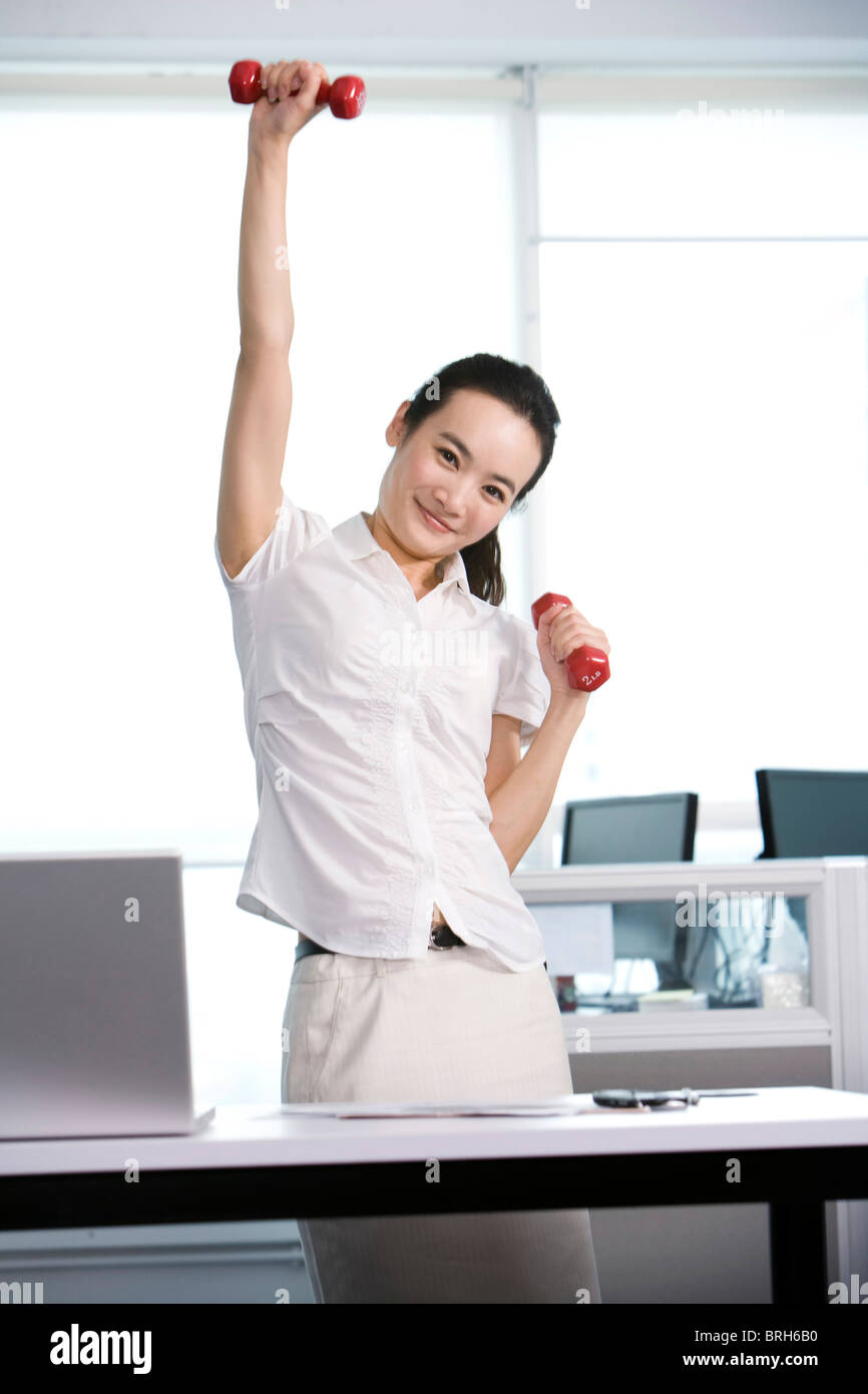 Working out in the office Stock Photo - Alamy