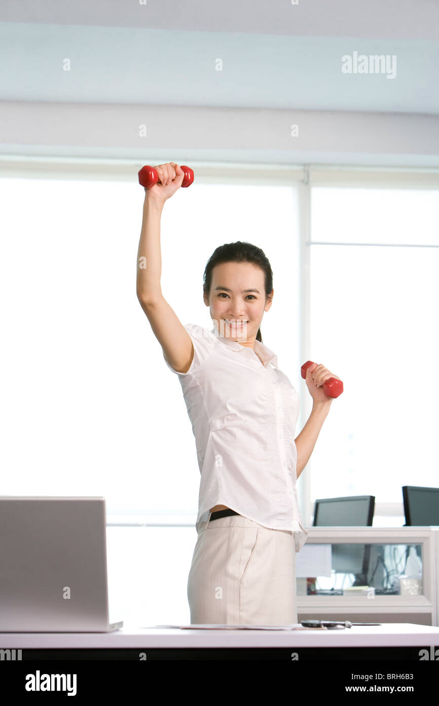 Working out in the office Stock Photo - Alamy
