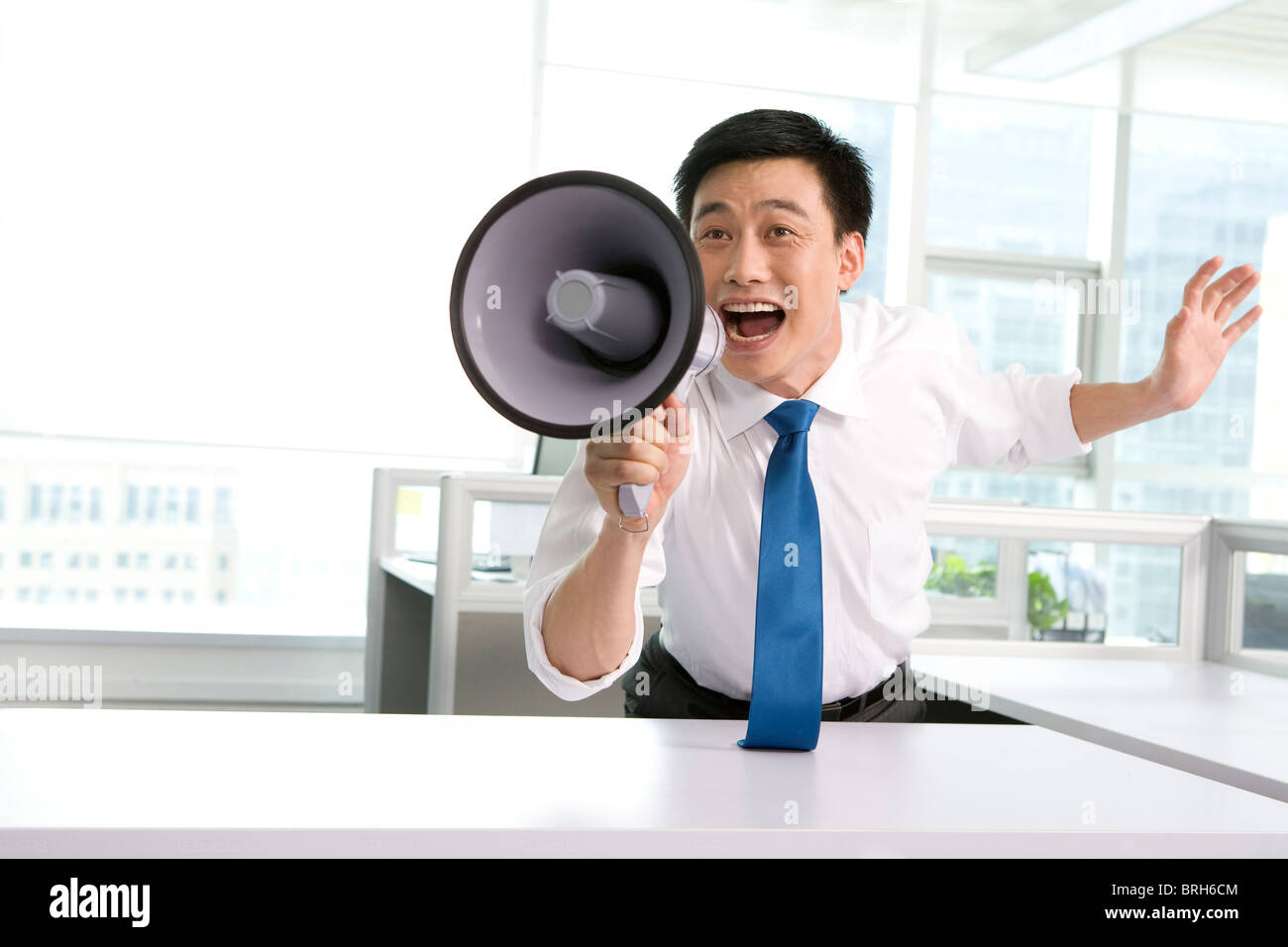 Getting loud in the office Stock Photo - Alamy