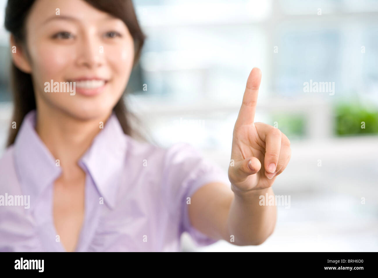 Office worker pointing Stock Photo - Alamy
