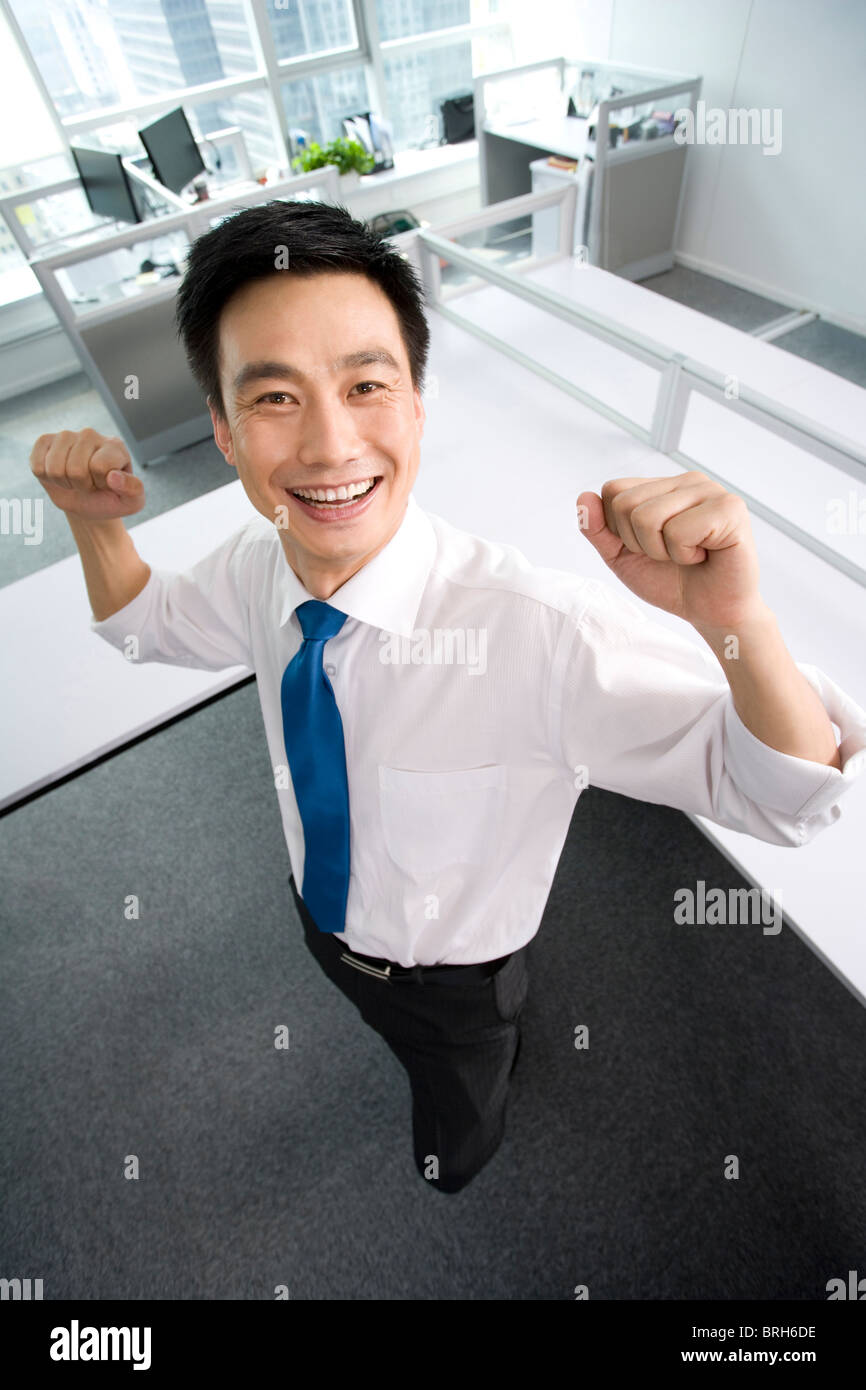 Happy office worker Stock Photo - Alamy
