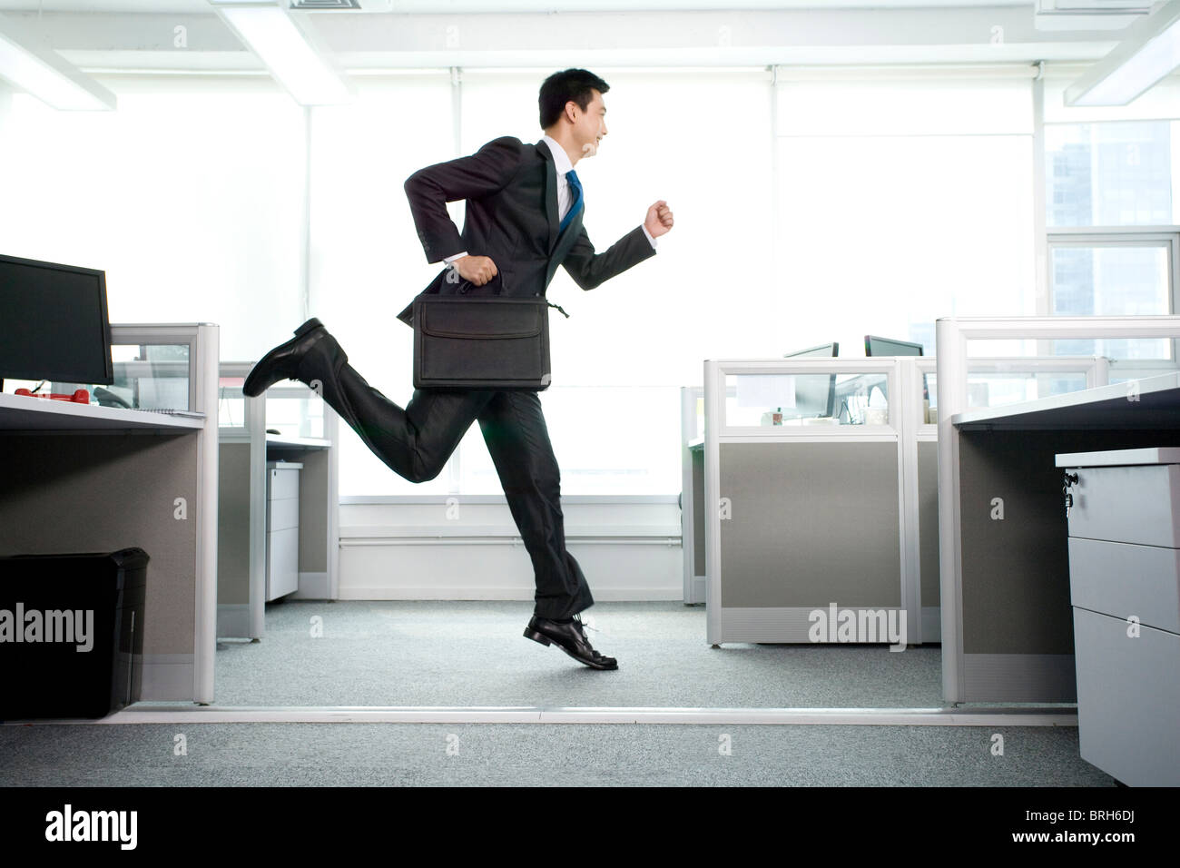 Running around in the office Stock Photo - Alamy
