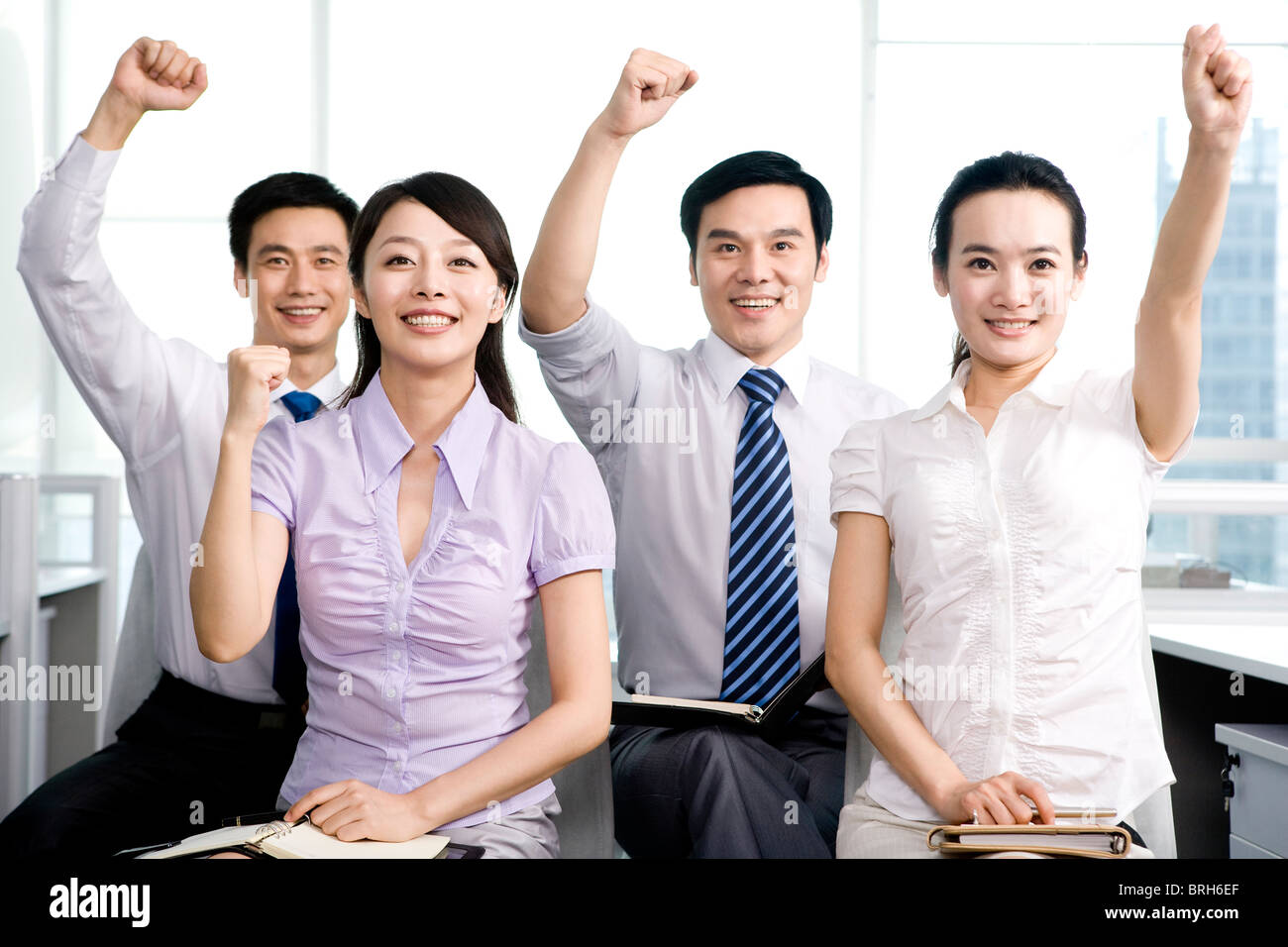 Cheering office workers Stock Photo - Alamy