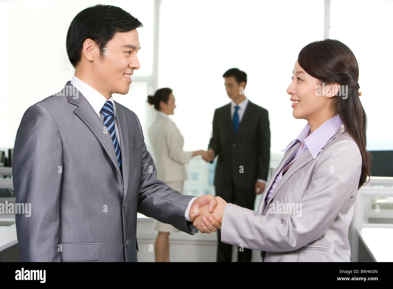 Business people shaking hands Stock Photo - Alamy