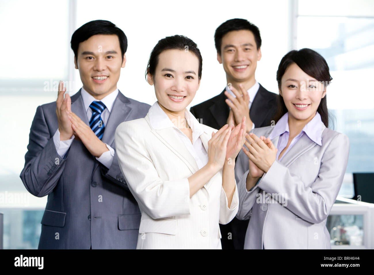 Cheering office workers Stock Photo - Alamy