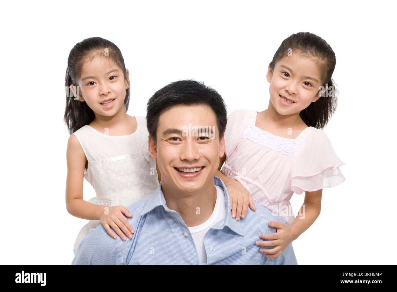 Portrait of father and two daughters Stock Photo - Alamy