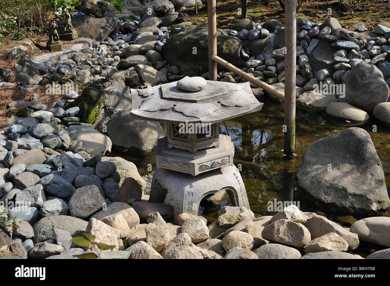 Stone lantern in Japanese garden Stock Photo - Alamy