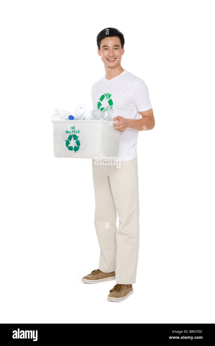 Mid-Adult man recycling Stock Photo - Alamy