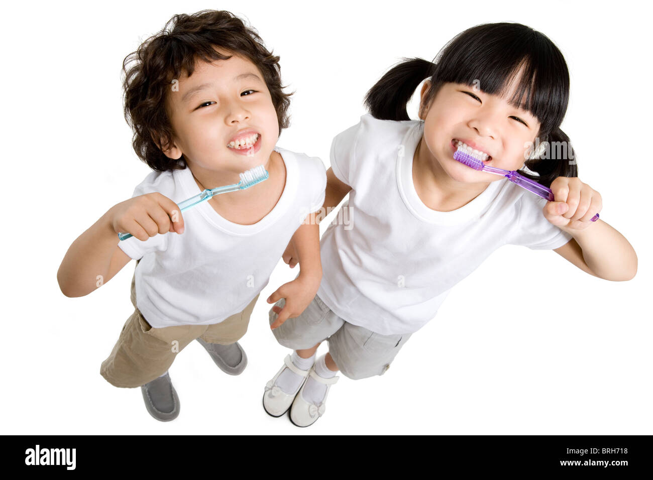 Kids brushing teeth Stock Photo - Alamy