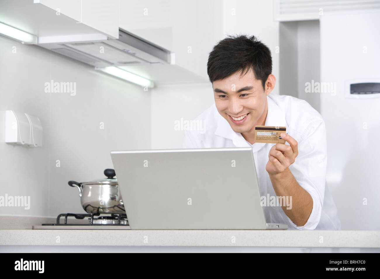 Man internet shopping at home Stock Photo - Alamy