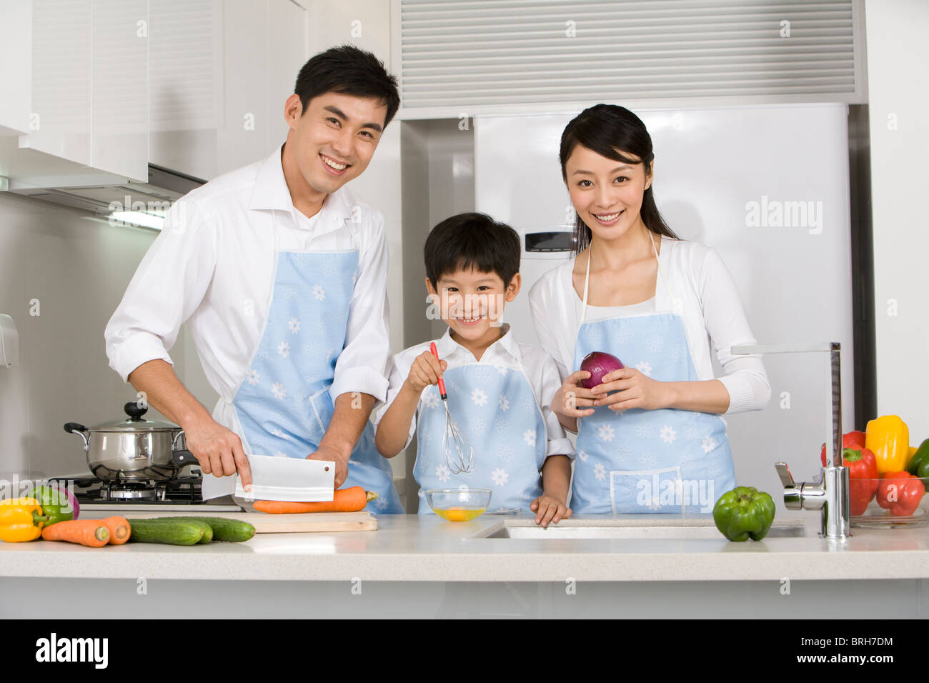 Family cooking in kitchen Stock Photo - Alamy