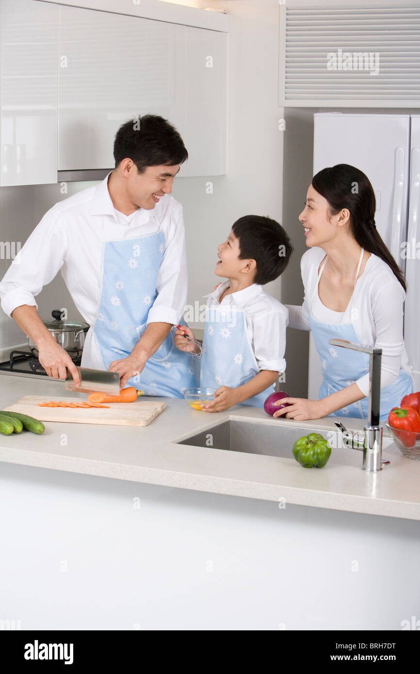 Family cooking in kitchen Stock Photo - Alamy