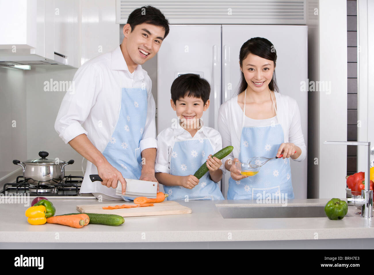 Family cooking in kitchen Stock Photo - Alamy