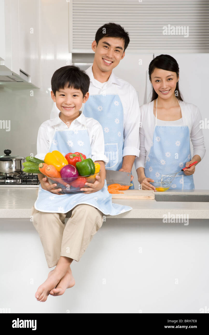 Family cooking in kitchen Stock Photo - Alamy