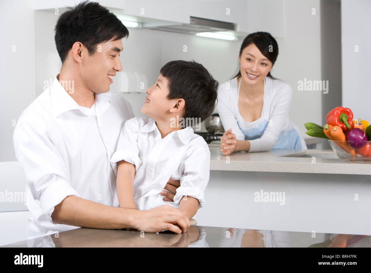 Women Sitting Around Kitchen Table High Resolution Stock Photography ...
