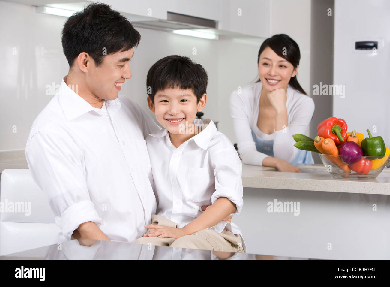 Women Sitting Around Kitchen Table High Resolution Stock Photography ...