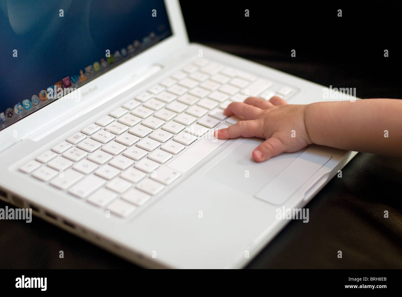 Baby using laptop Stock Photo - Alamy