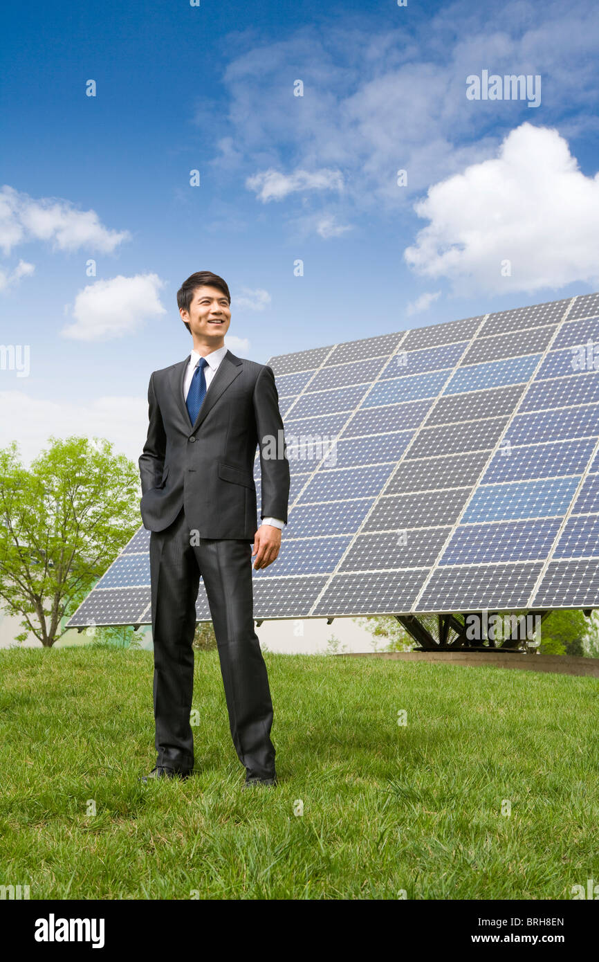 Portrait of a businessman in front of solar panels Stock Photo - Alamy