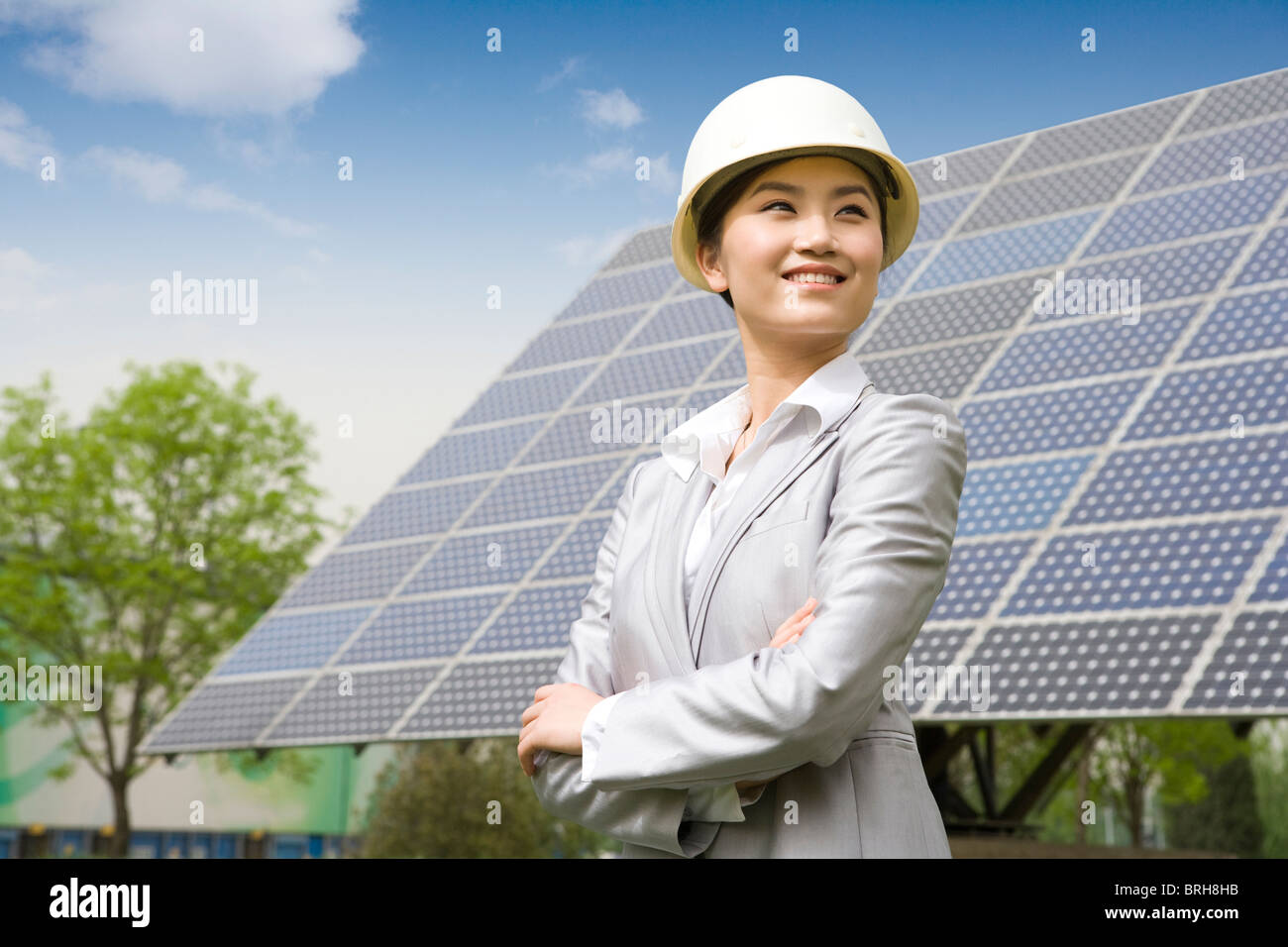 Portrait of an engineer in front of solar panels Stock Photo - Alamy