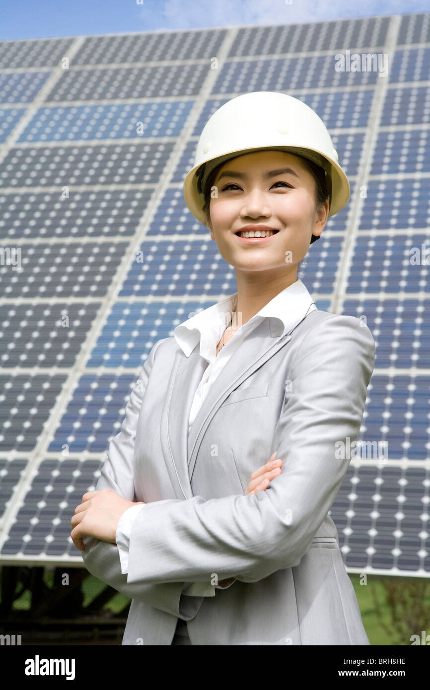 Portrait of an engineer in front of solar panels Stock Photo - Alamy