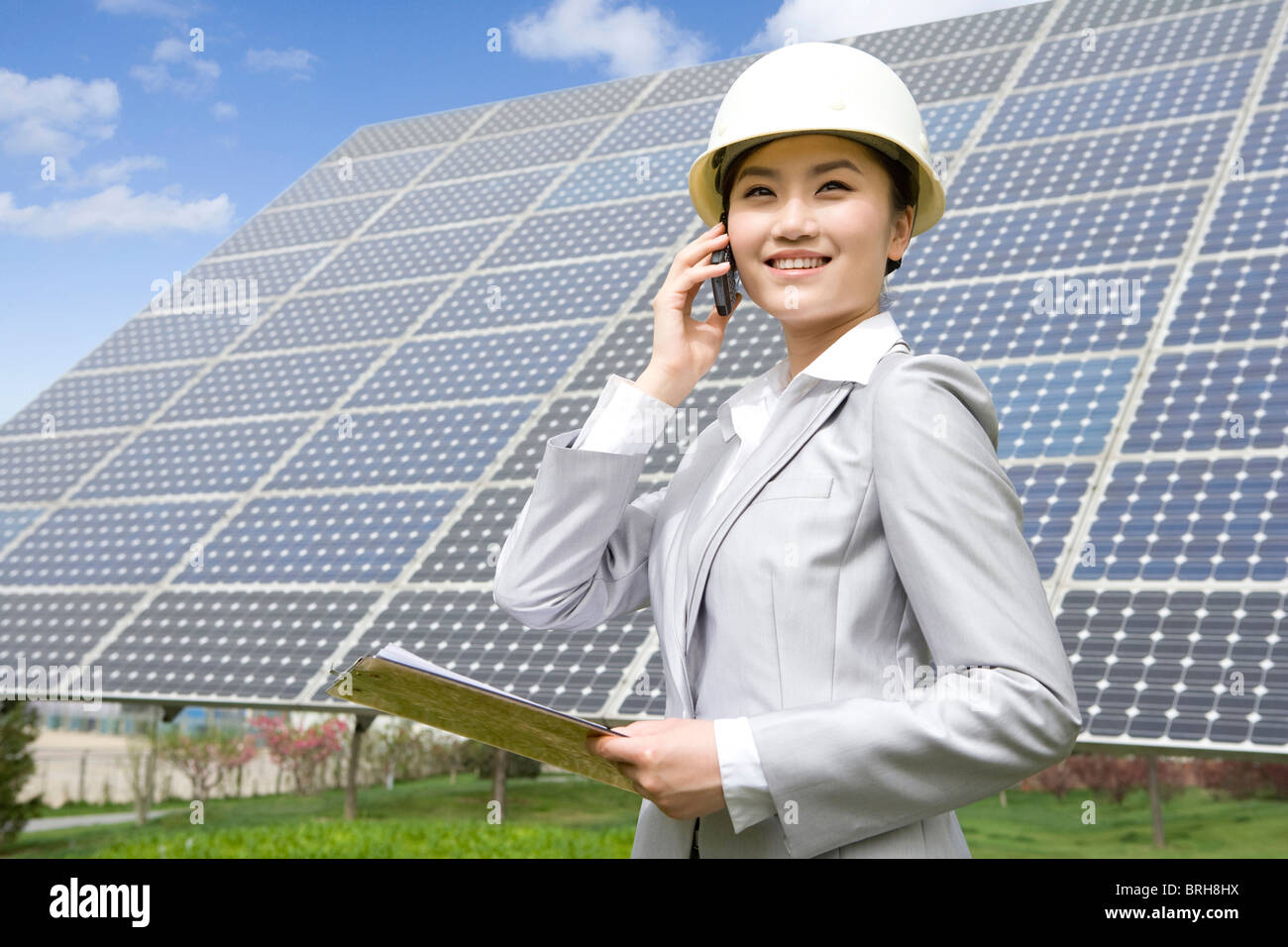 Portrait of an engineer in front of solar panels Stock Photo - Alamy