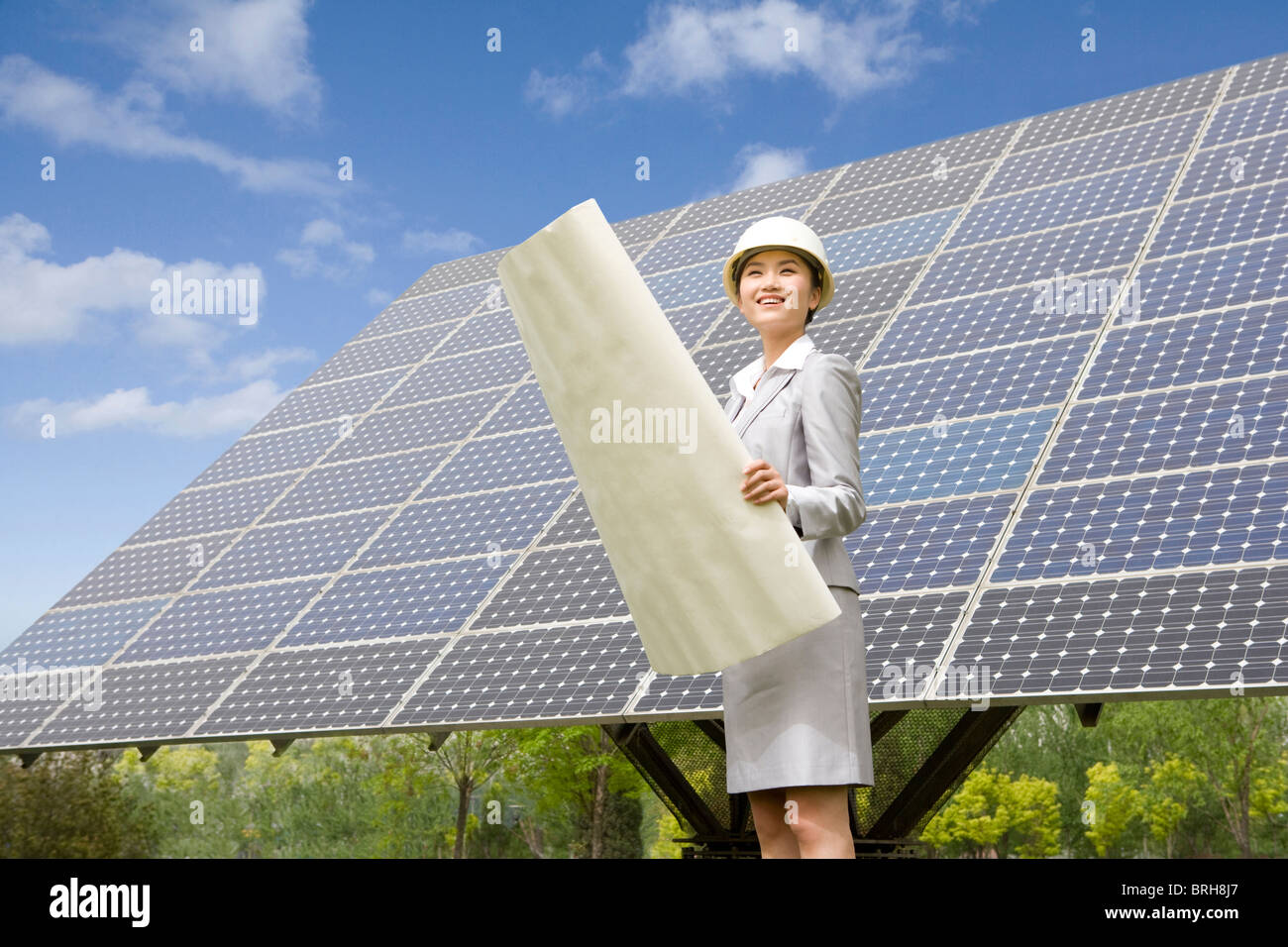 Portrait of an engineer in front of solar panels Stock Photo - Alamy