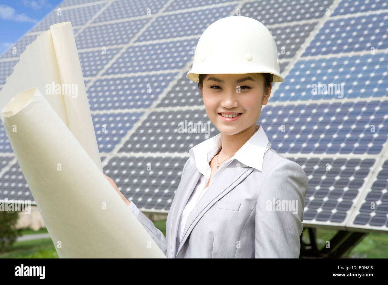 Portrait of an engineer in front of solar panels Stock Photo - Alamy