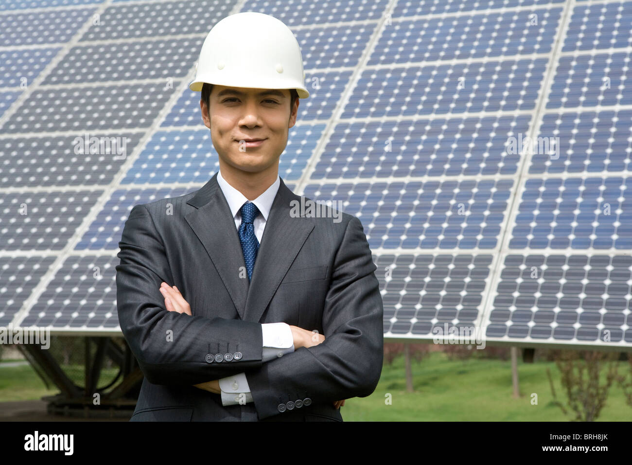 Portrait of an engineer in front of solar panels Stock Photo - Alamy
