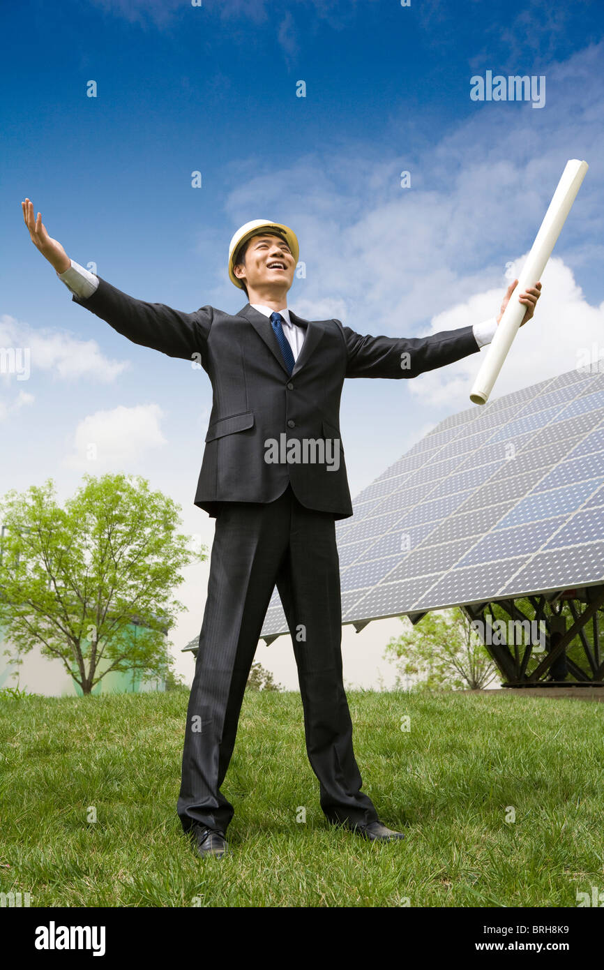 Portrait of an engineer in front of solar panels Stock Photo - Alamy