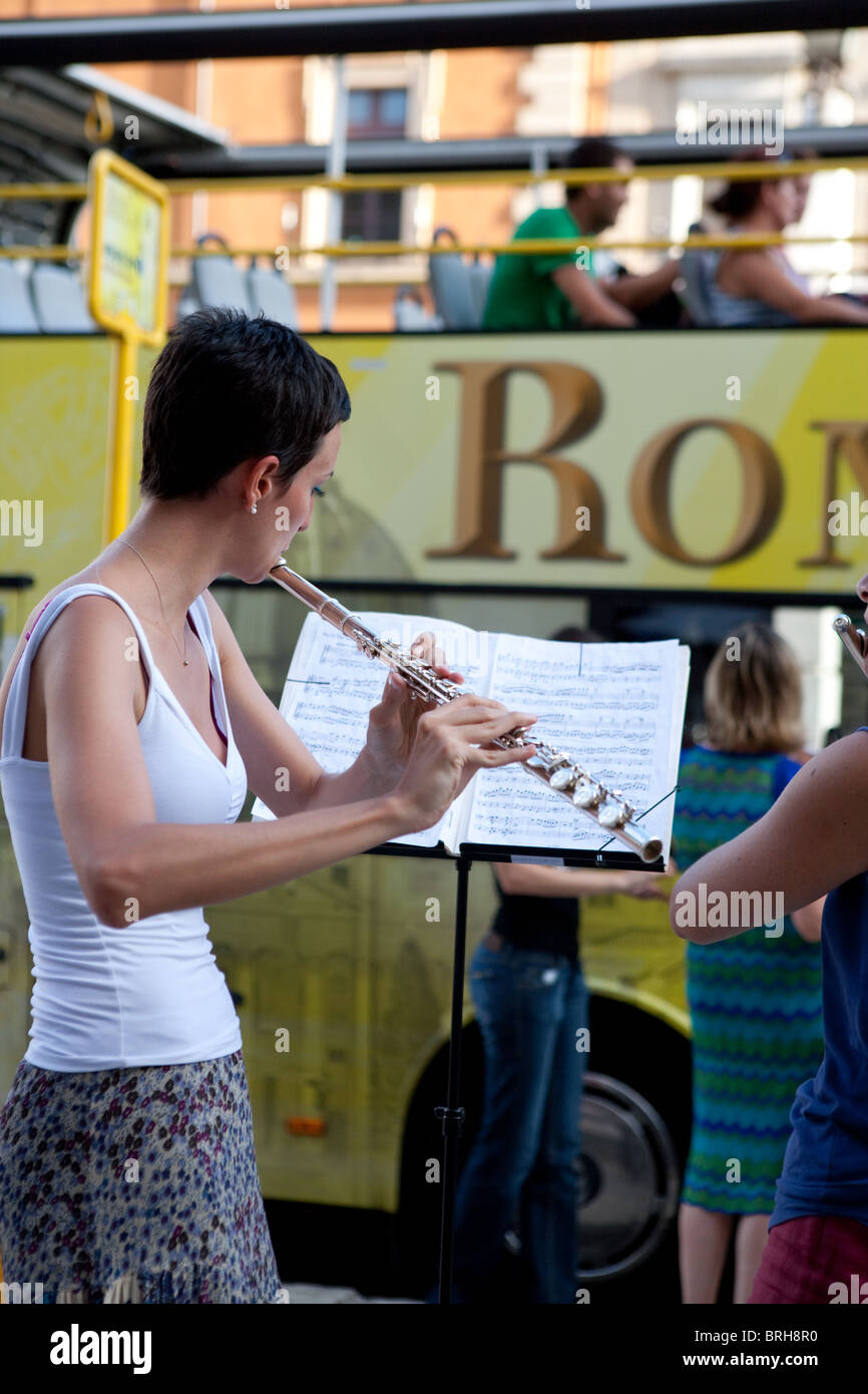 Buskers street musicians artists players play city Stock Photo - Alamy