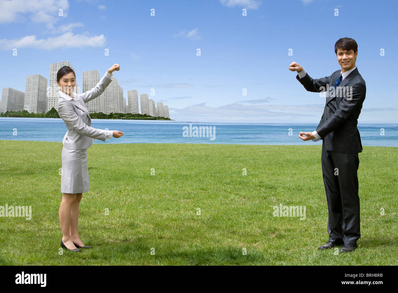 Businesspeople holding an invisible sign Stock Photo - Alamy