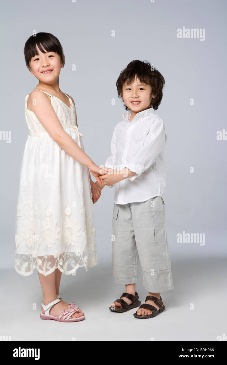 Children holding hands Stock Photo - Alamy