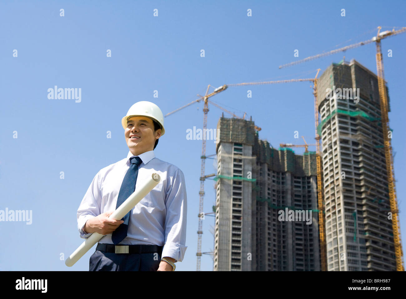 Professional engineer smiling looking skyscraper hi-res stock ...