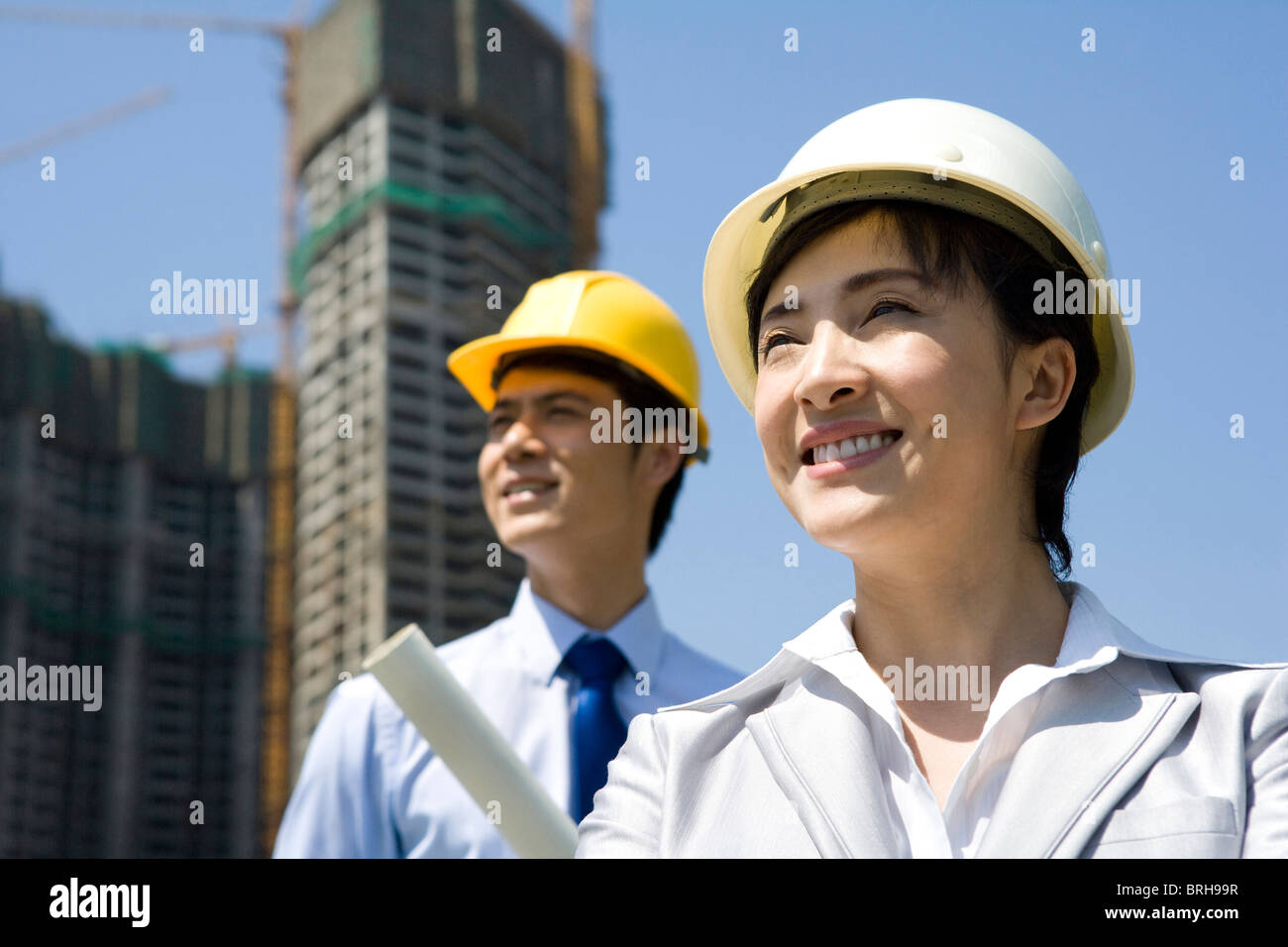Professional engineer smiling looking skyscraper hi-res stock photography and images - Alamy