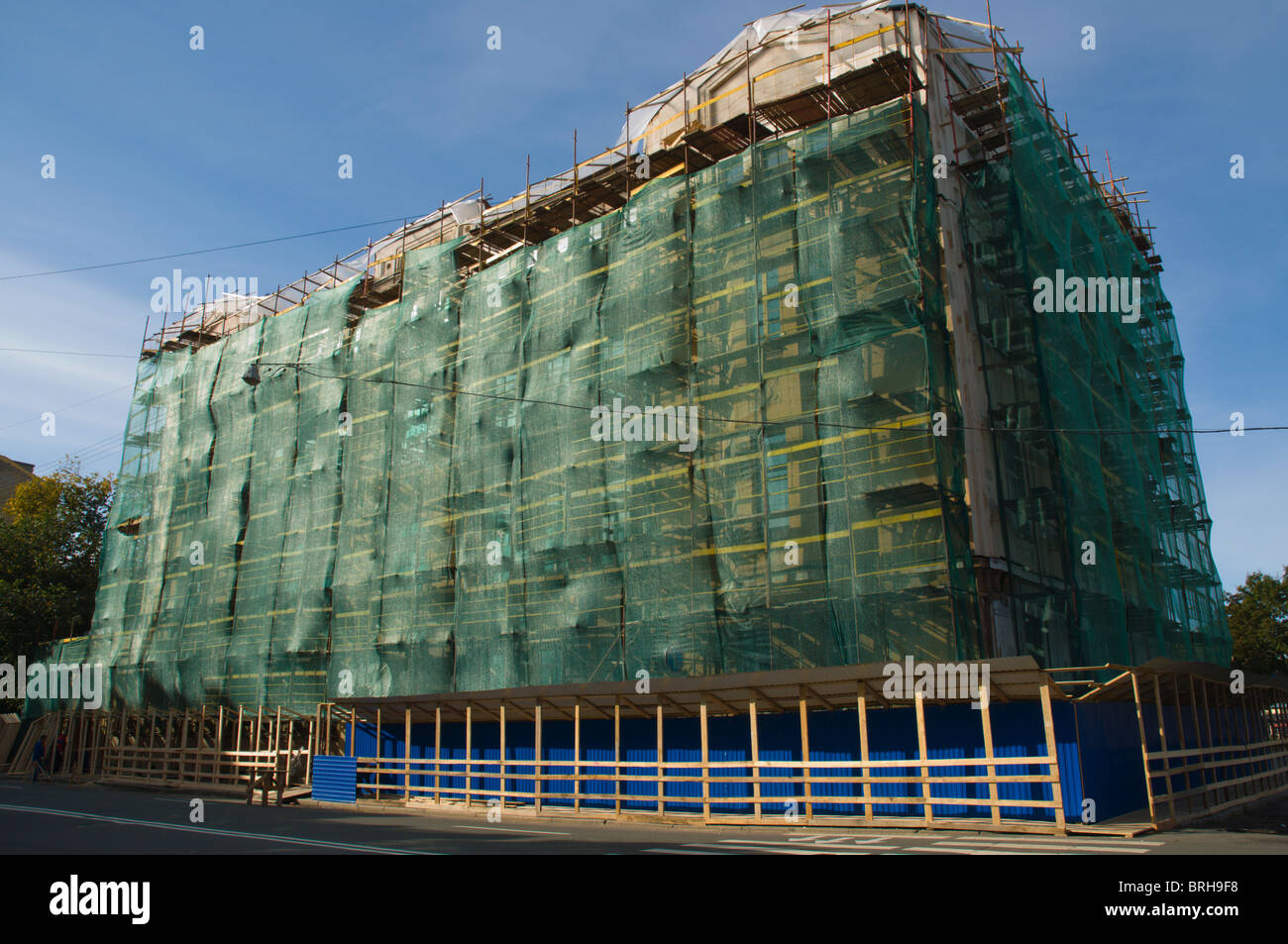 Building renovation building covered with scaffolding central St ...