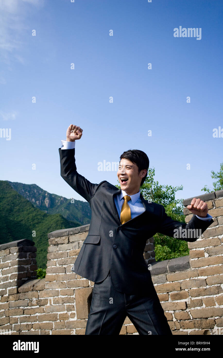 Happy businessman on the Great Wall Stock Photo - Alamy