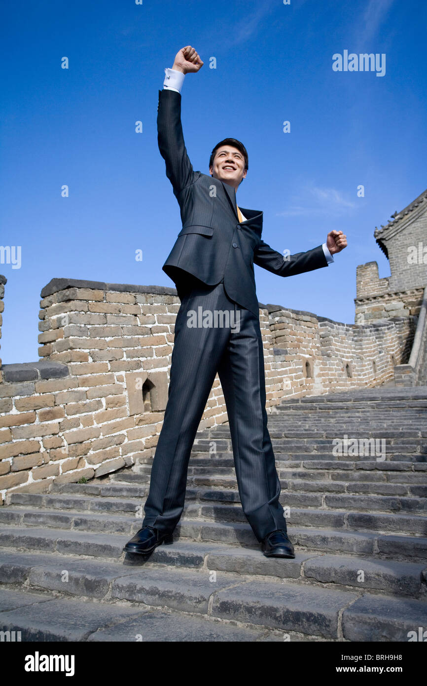 Happy businessman on the Great Wall Stock Photo - Alamy